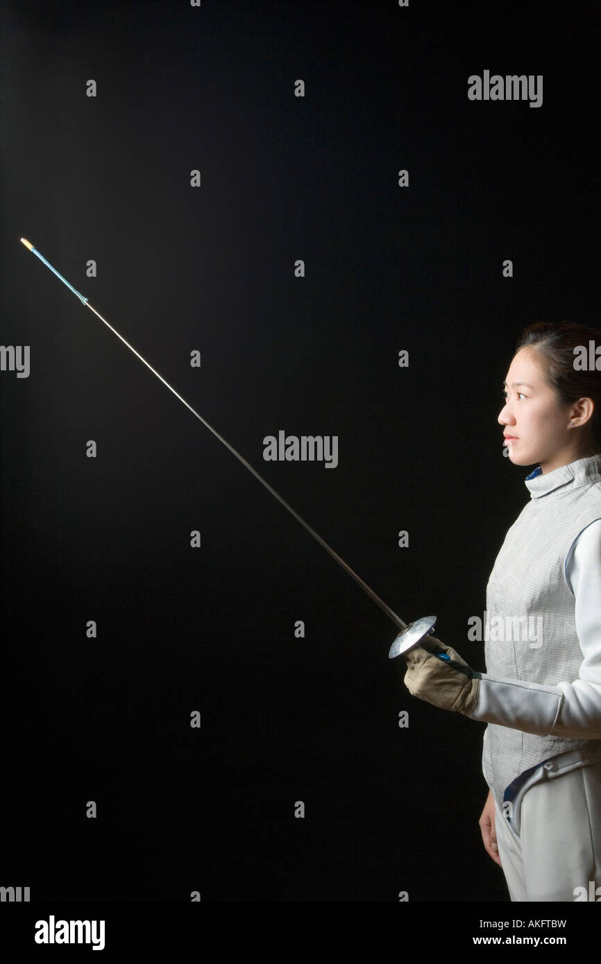 Female fencer holding fencing foil hi-res stock photography and images - Alamy