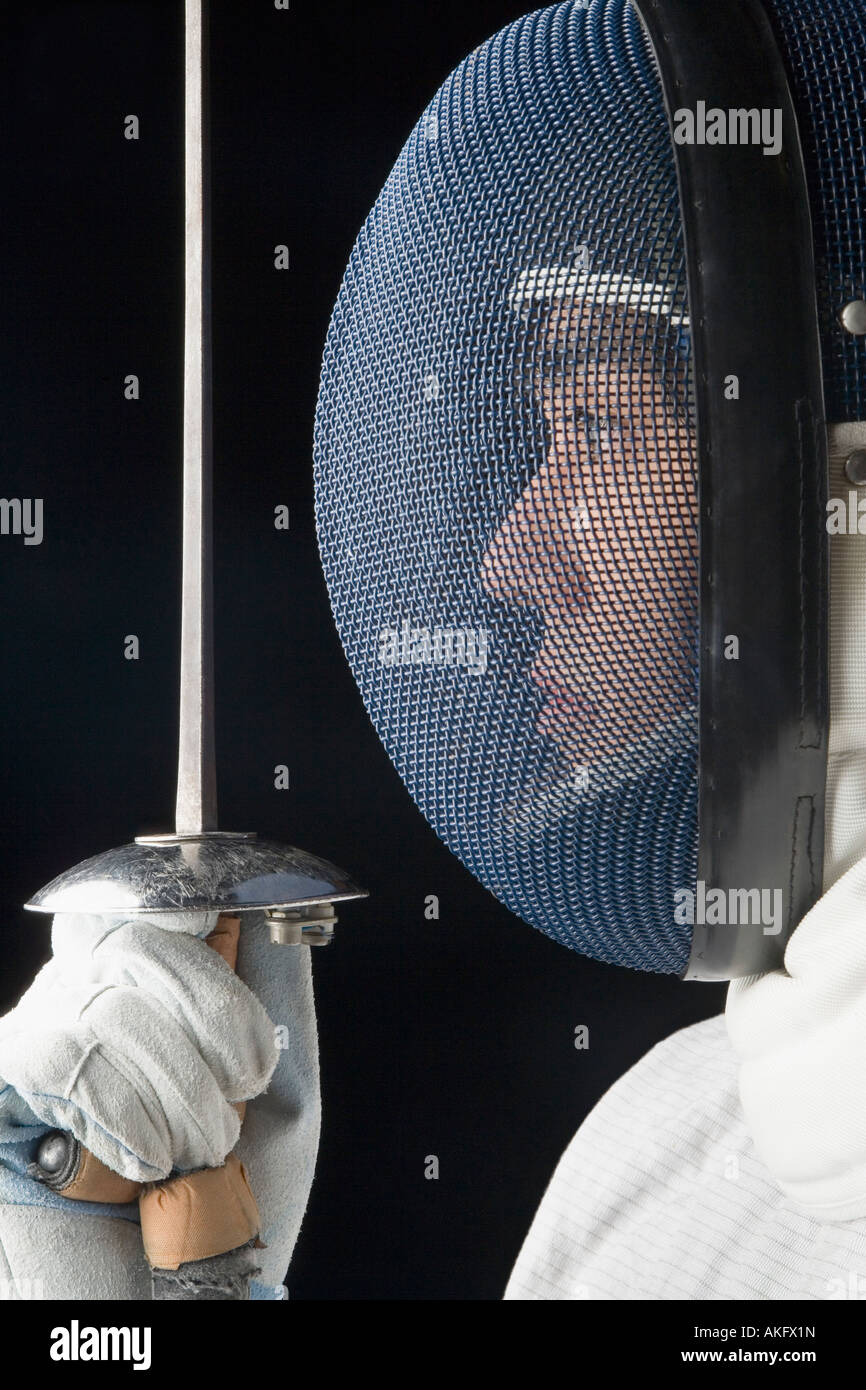 Side profile of a male fencer holding a fencing foil Stock Photo - Alamy