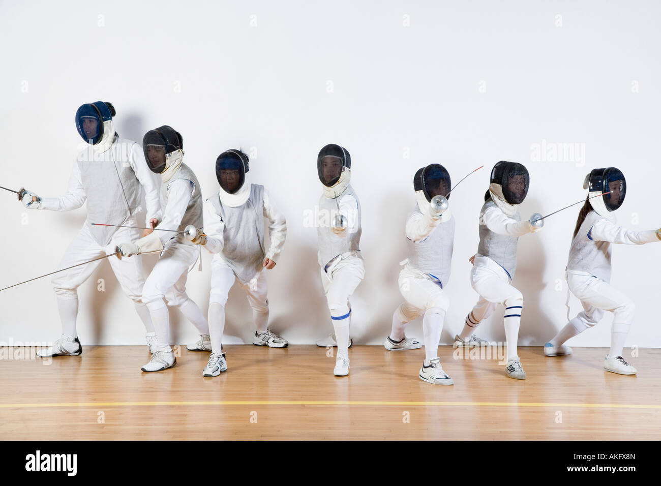 Group of people fencing Stock Photo - Alamy