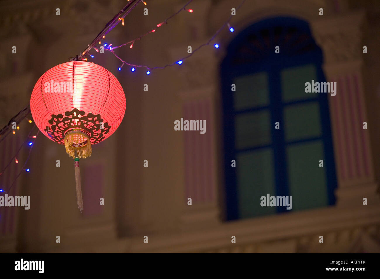 Low angle view of a Chinese lantern lit up at night, Chinatown ...