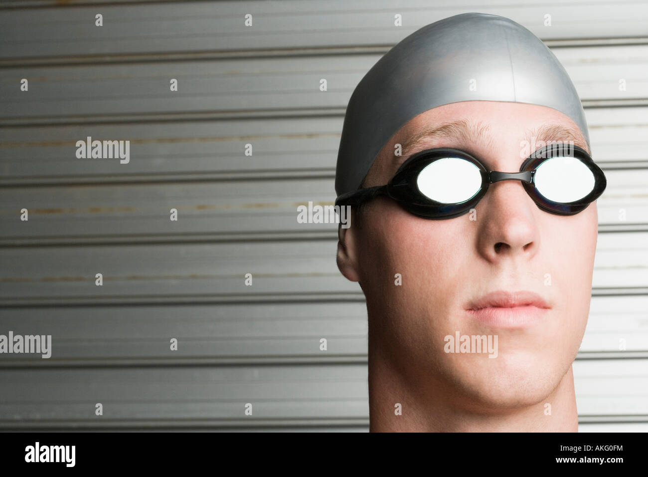 Young man wearing swimming cap and goggles hi-res stock photography and ...
