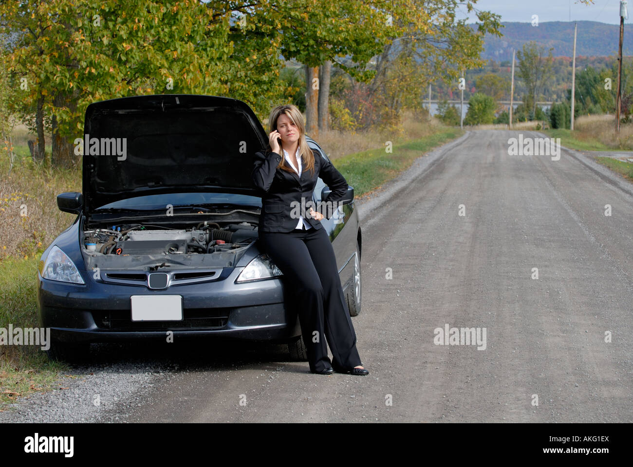 Stranded female motorist hi-res stock photography and images - Alamy