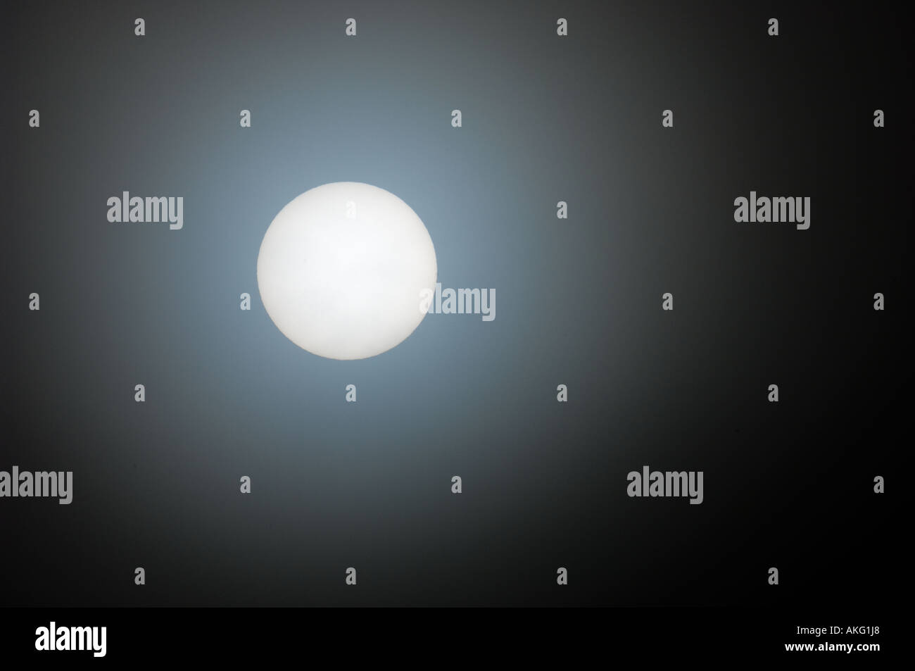 The sun shining through fog Stock Photo - Alamy