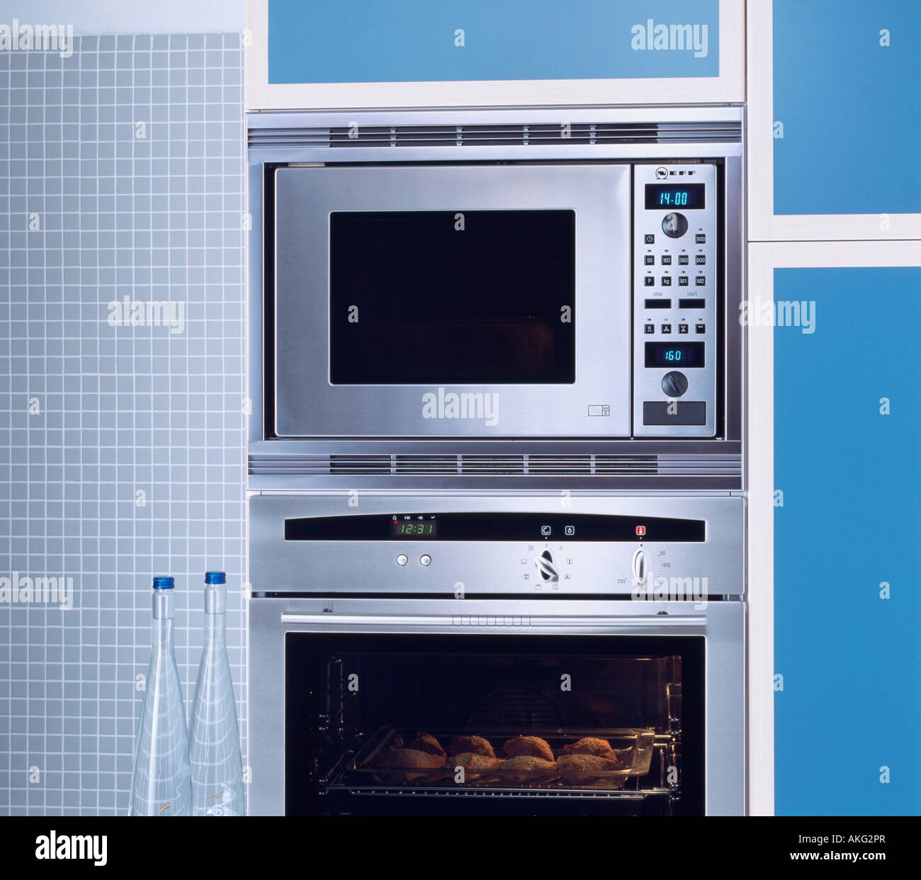 Close up of stainless steel microwave oven in modern blue kitchen Stock ...