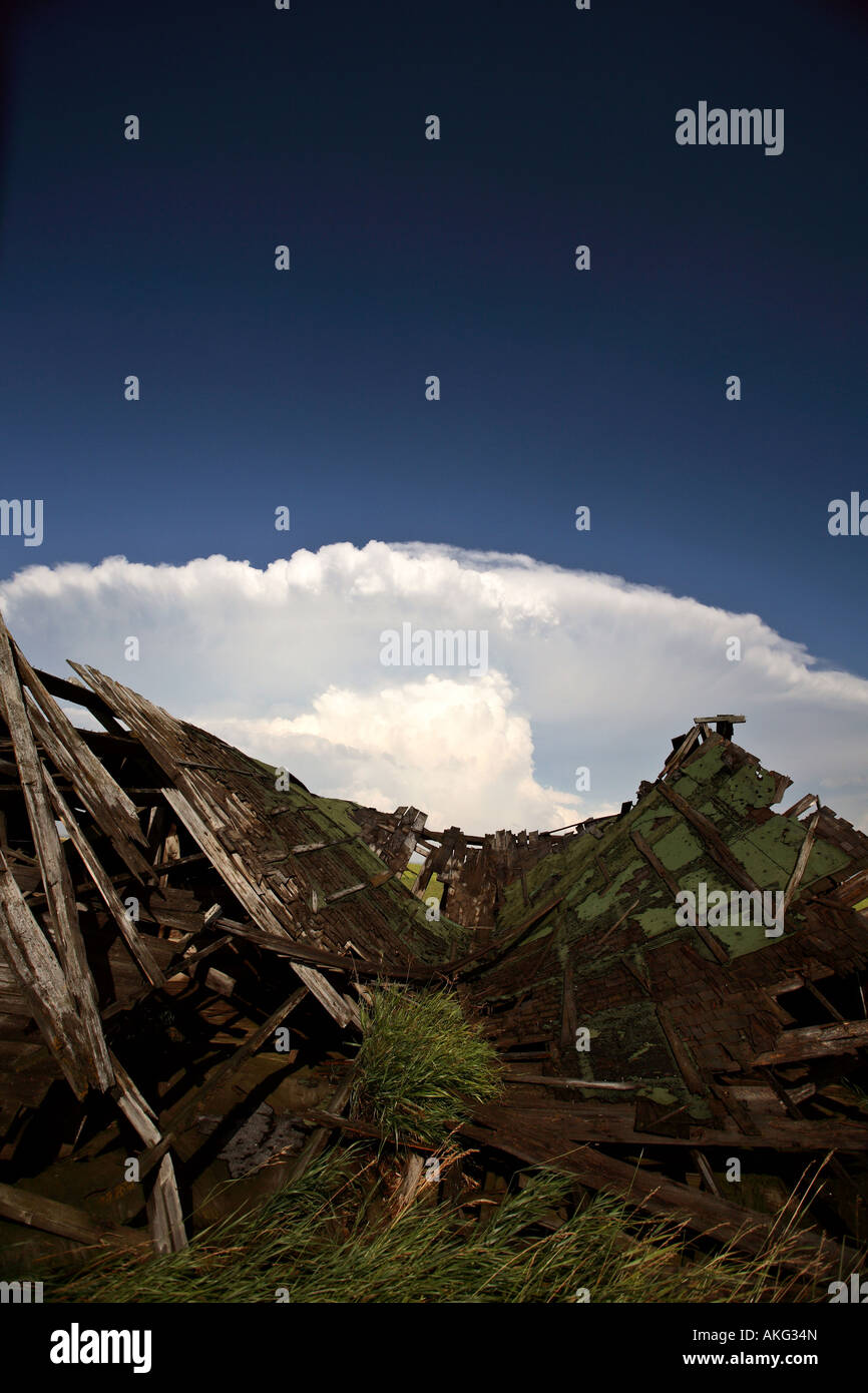 Collapsed building with Cumulonimbus clouds in background Stock Photo ...