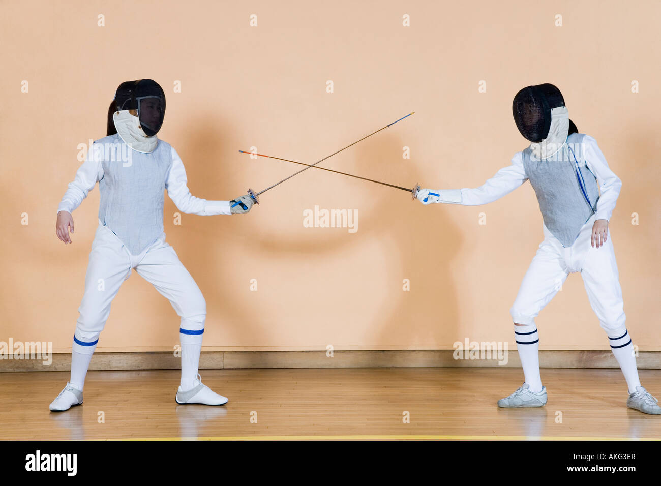 Two fencers fencing Stock Photo - Alamy