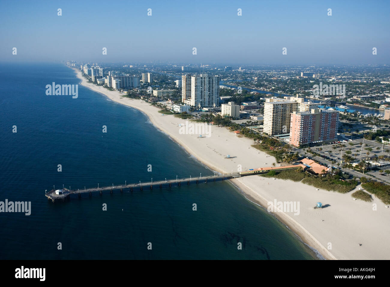 Aerial view of waterfront buildings and pier over ocean at Pompano ...