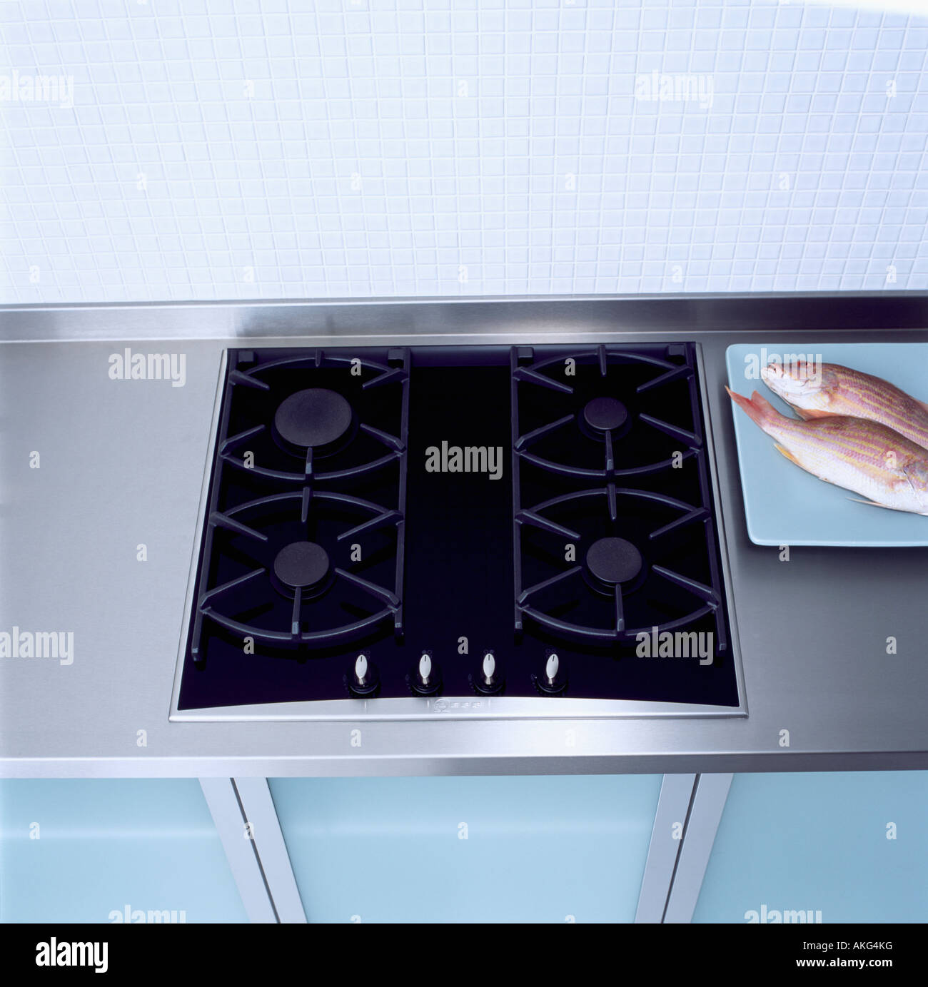 Close up black gas hob in modern kitchen Stock Photo - Alamy