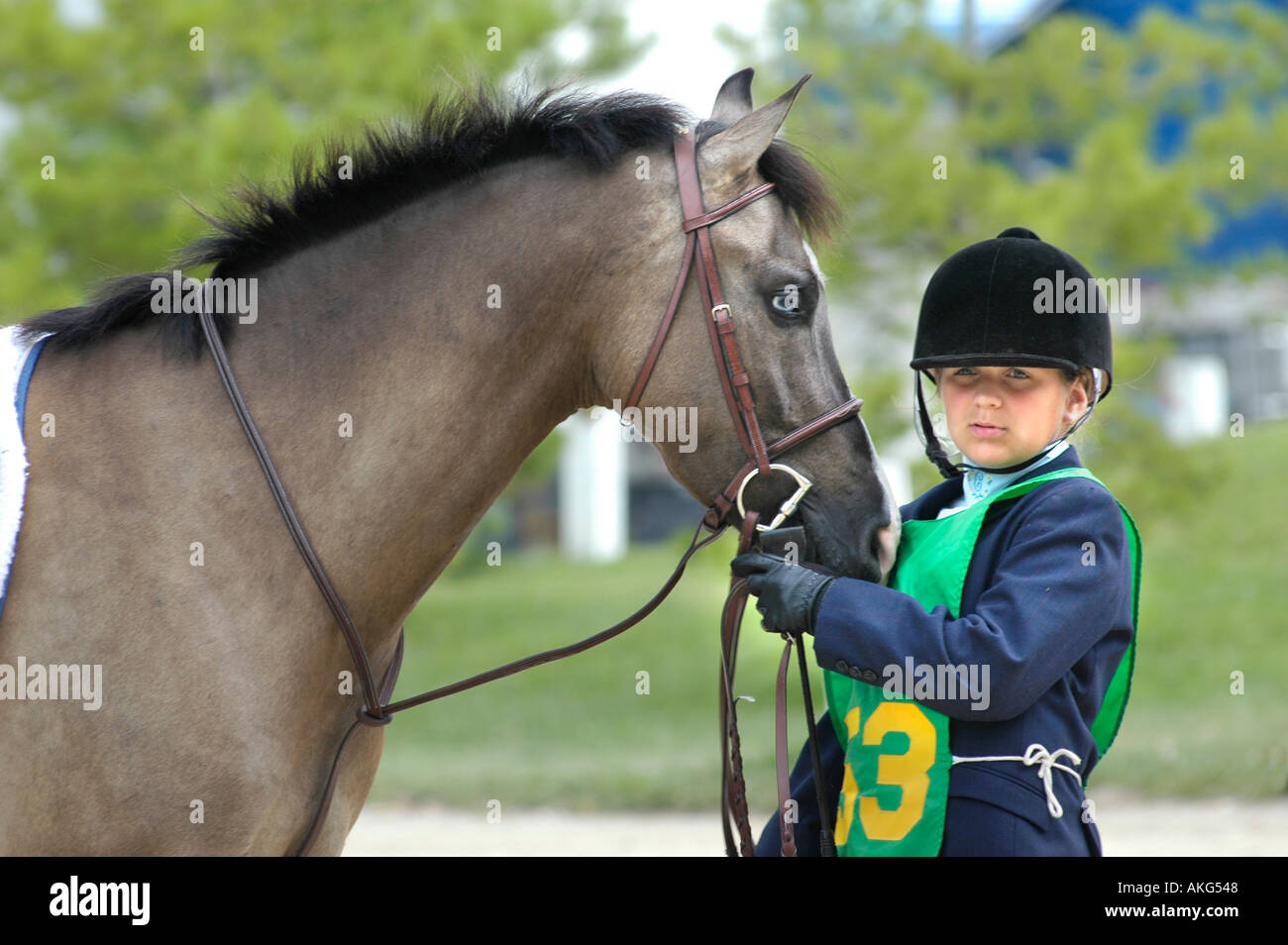 Girl riders and horses at Equestrian event Stock Photo - Alamy