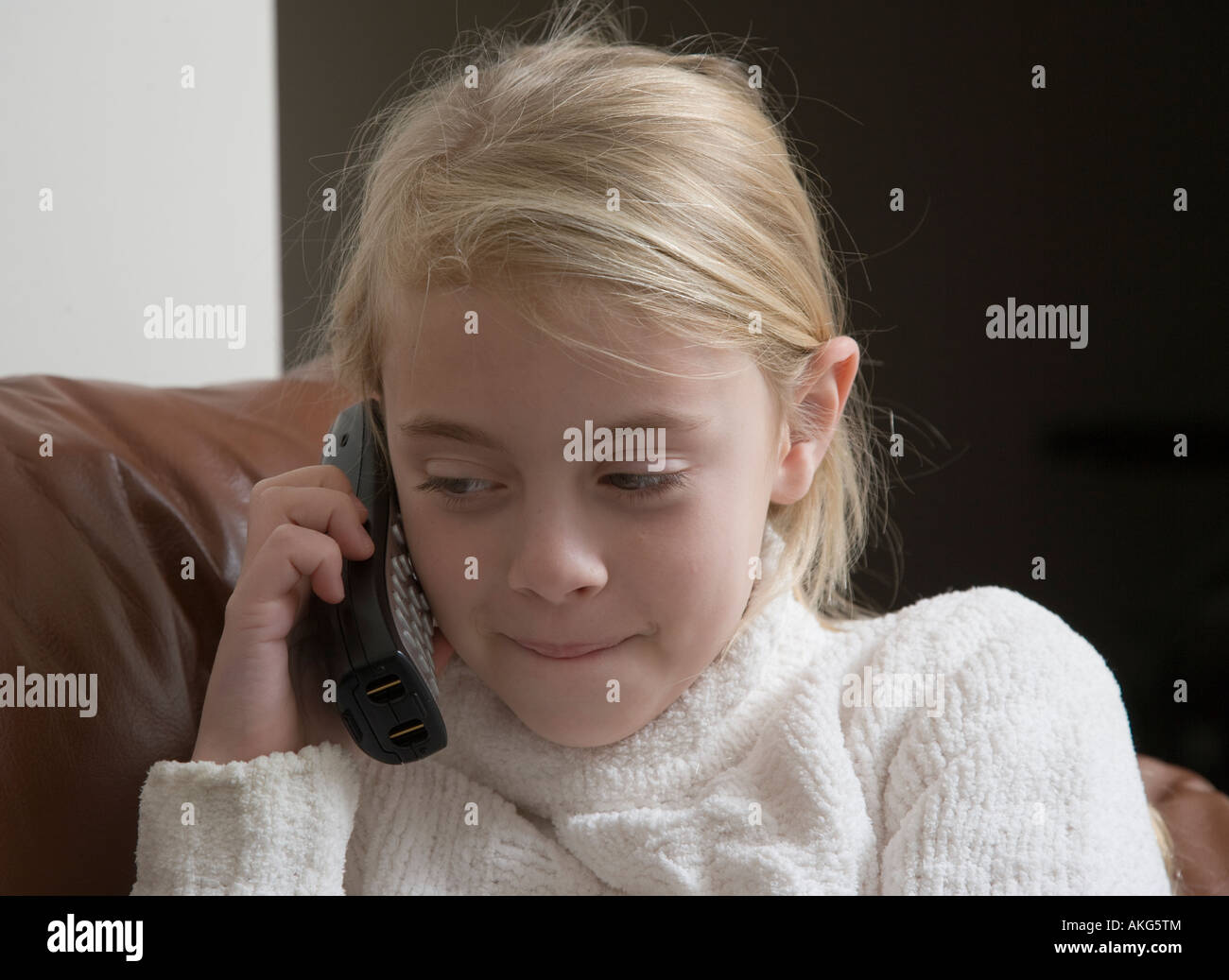 Child talking on a telephone Stock Photo - Alamy