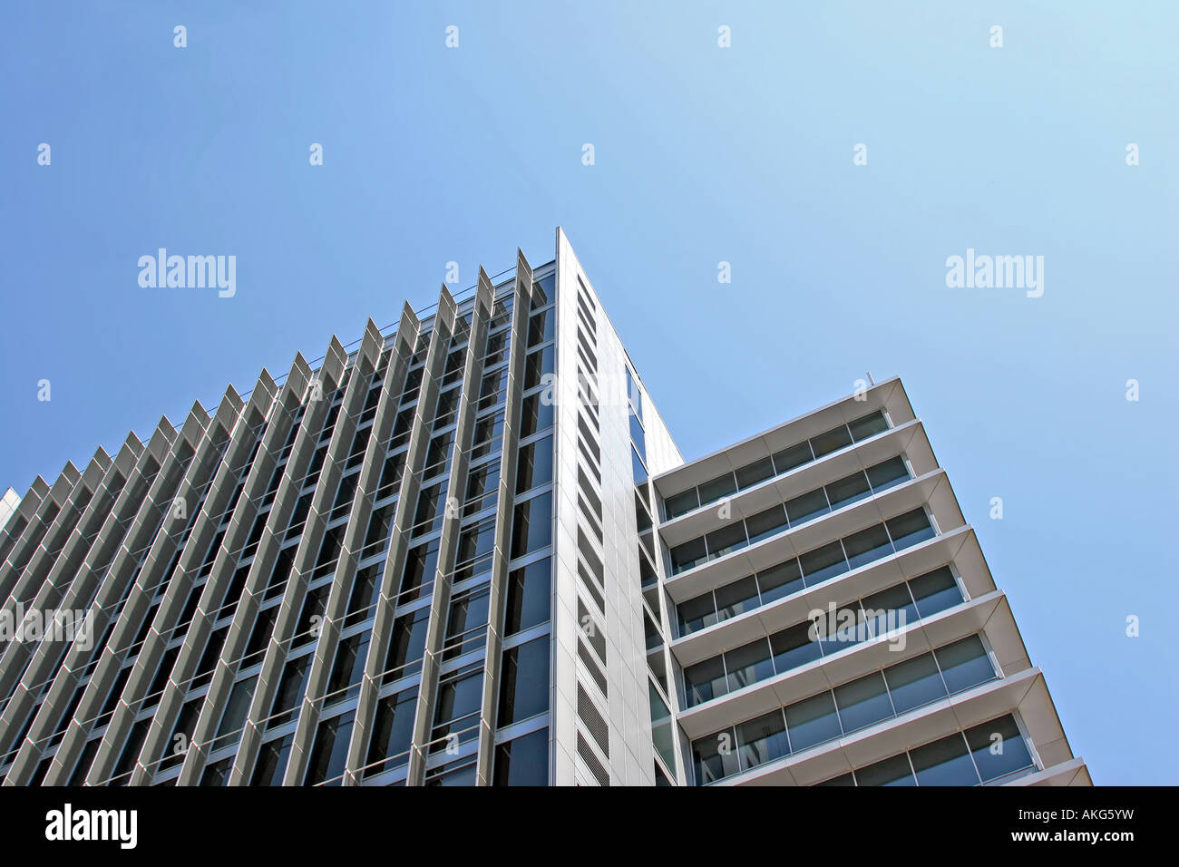tall black office building against a blue sky in a horizontal ...
