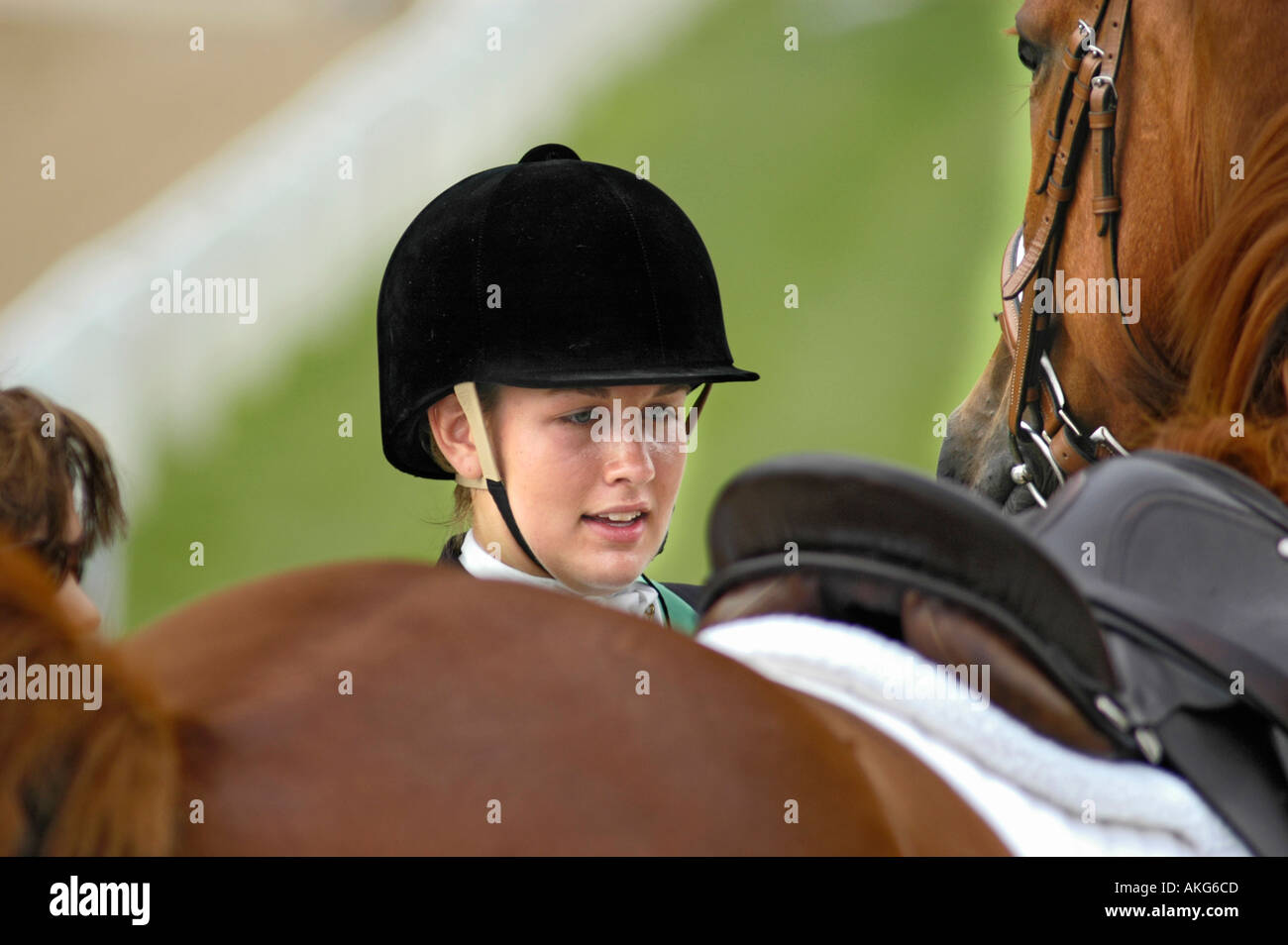 Girl riders and horses at Equestrian event Stock Photo - Alamy