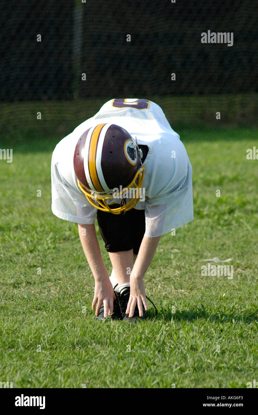 Kids football practice for full contact sport Stock Photo - Alamy