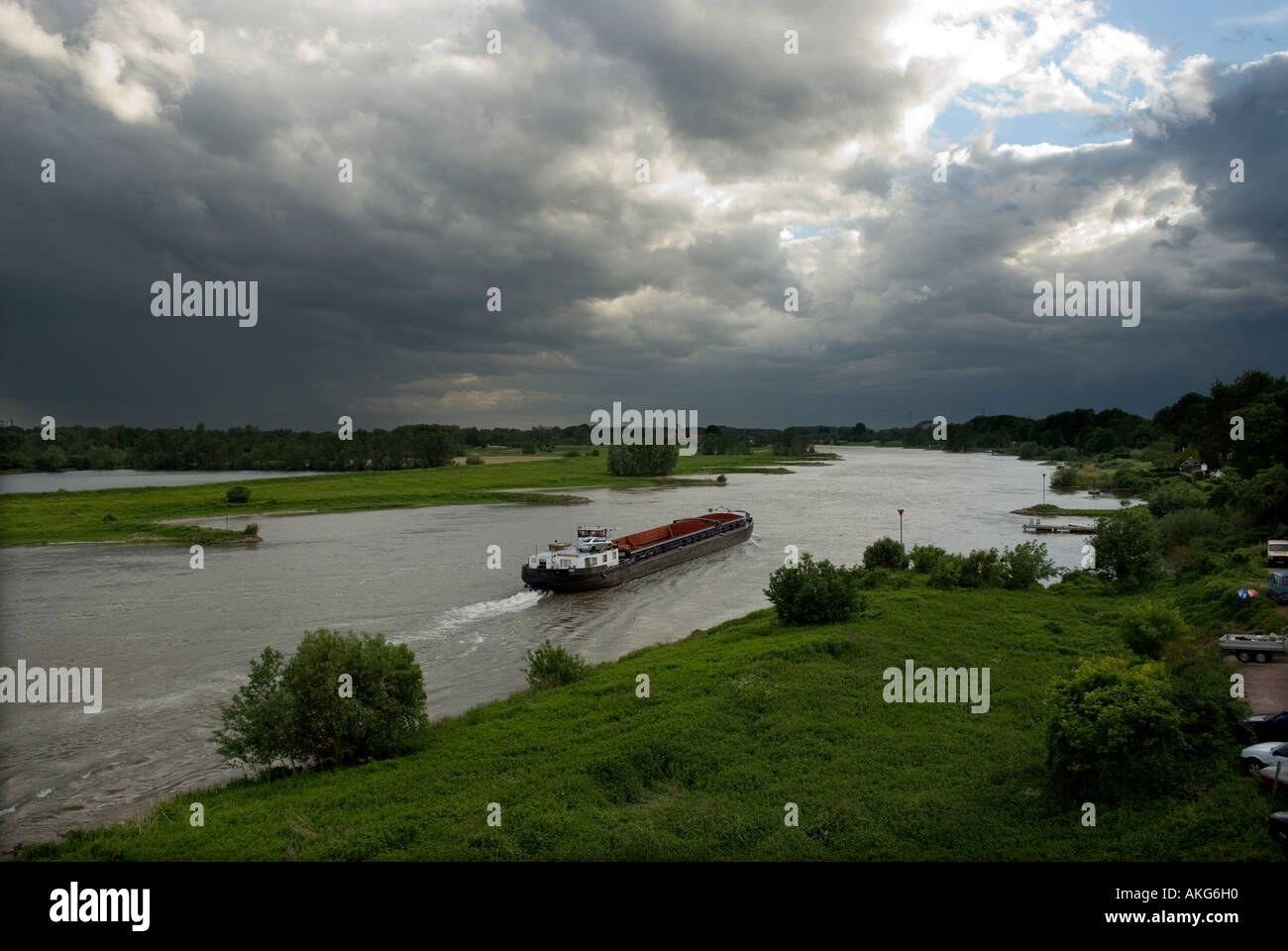 HOLLAND NETHERLANDS ARNHEM AND THE RIVER RHINE A BARGE ON THE RIVER ...
