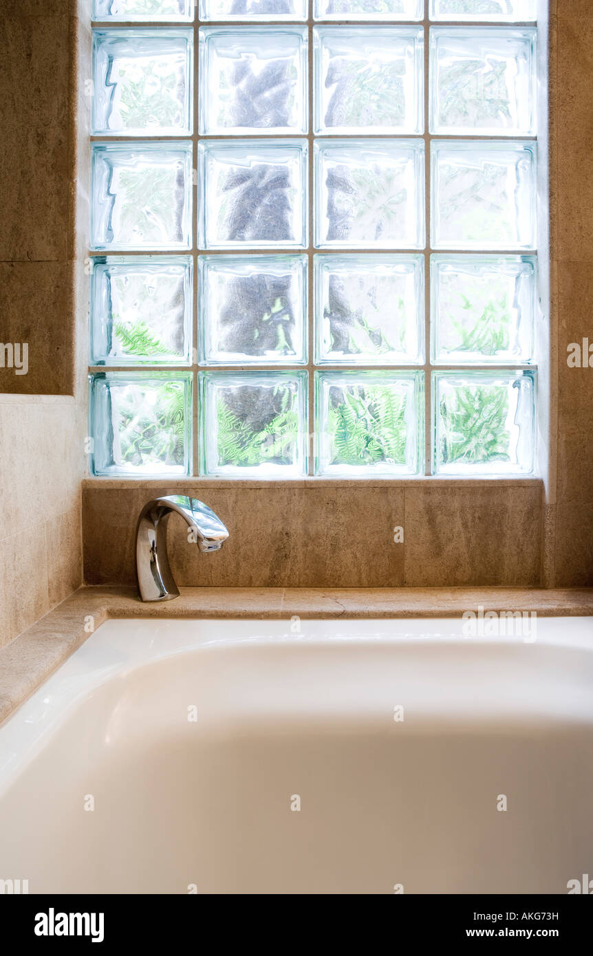Detail of bathtub and cubed glass window Stock Photo - Alamy