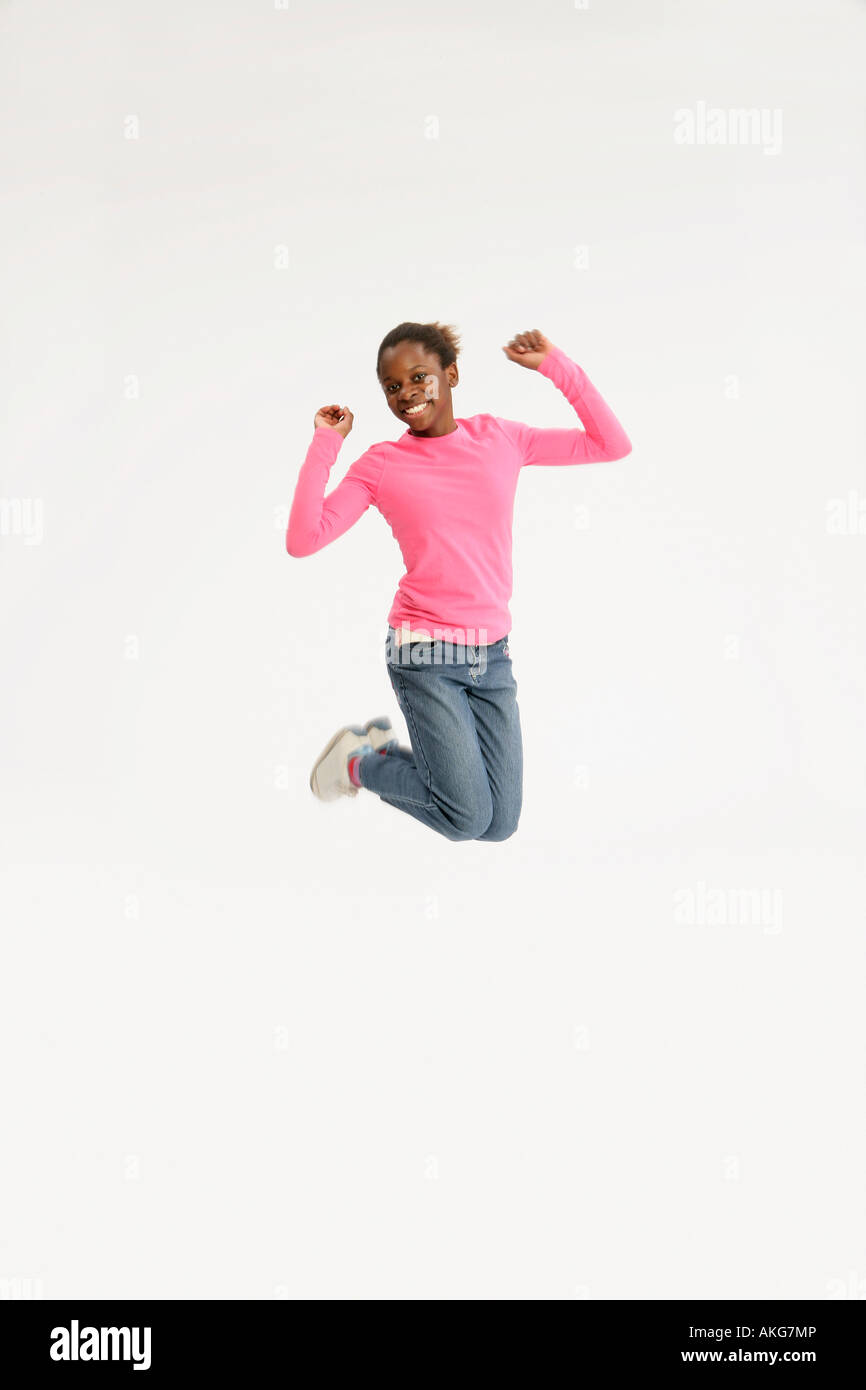 Front view of girl jumping Stock Photo - Alamy
