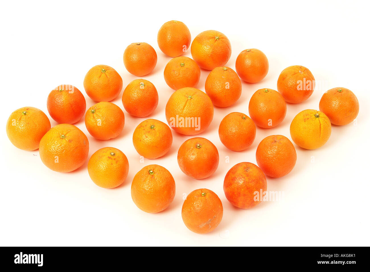 oranges arranged on a white background symbolizing teamwork leadership ...