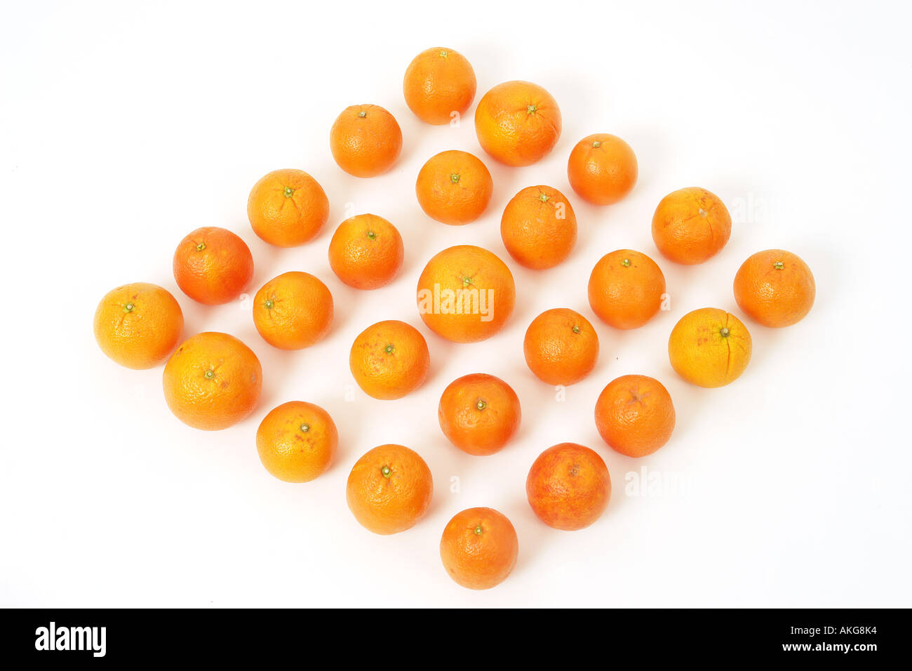oranges arranged on a white background symbolizing teamwork leadership ...