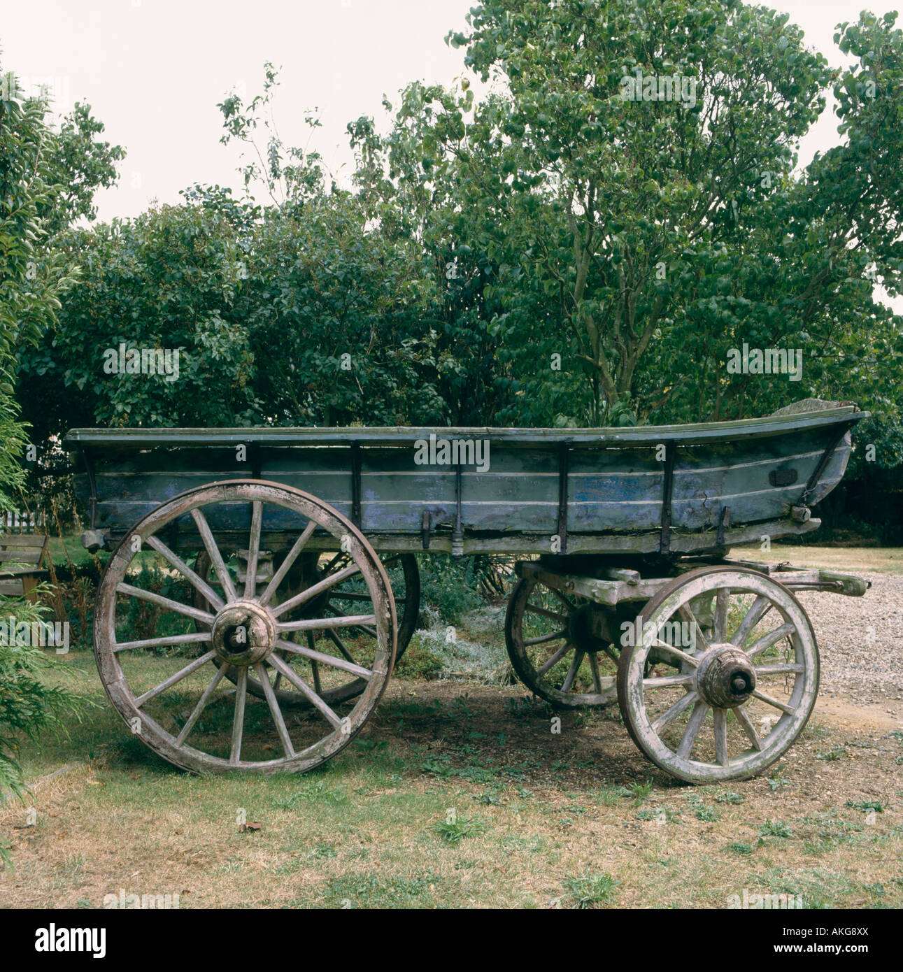 Old wooden farm cart in country garden Stock Photo - Alamy