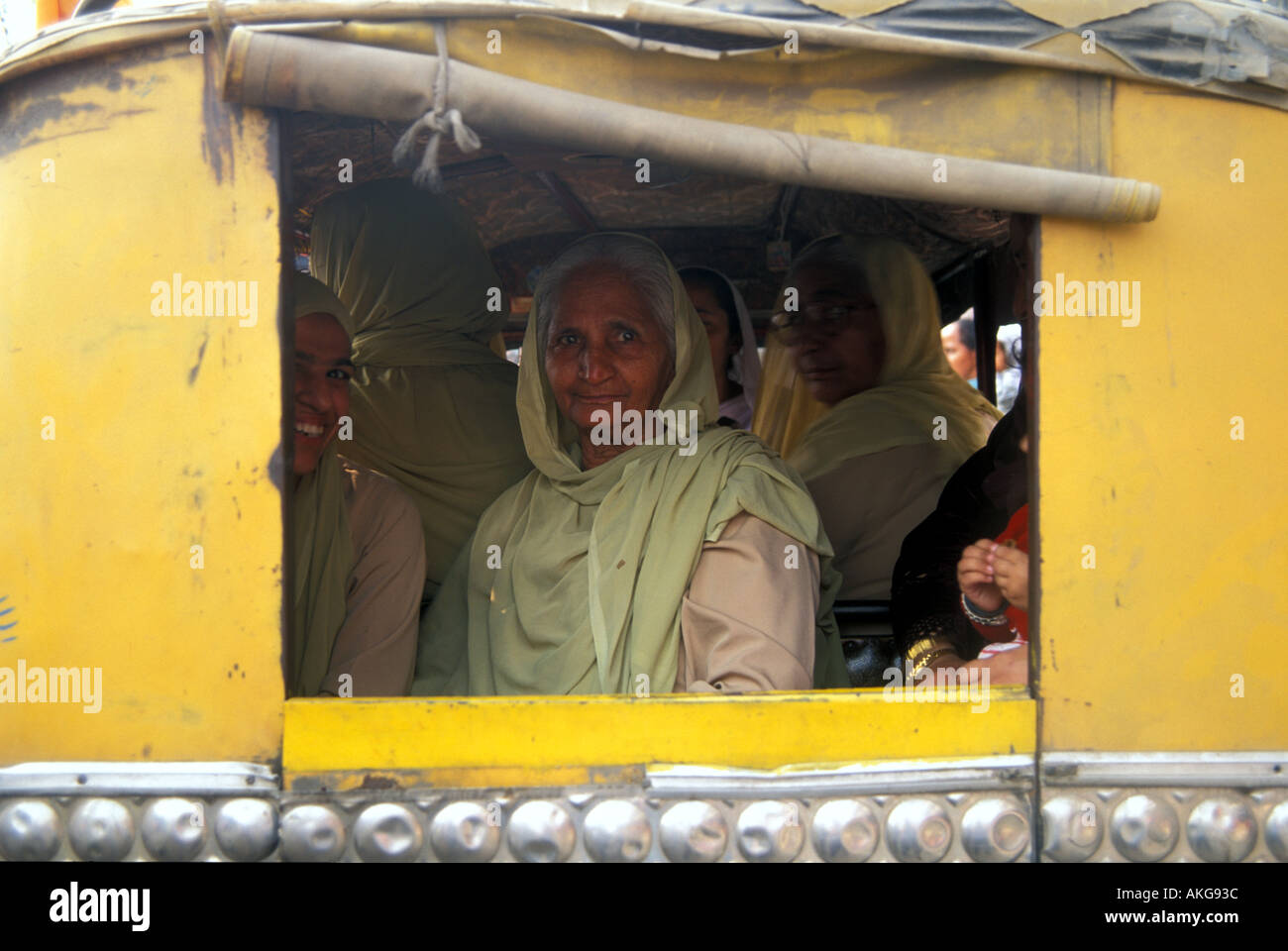 A woman sitting in the back of an auto rickshaw Amritsar India Stock ...