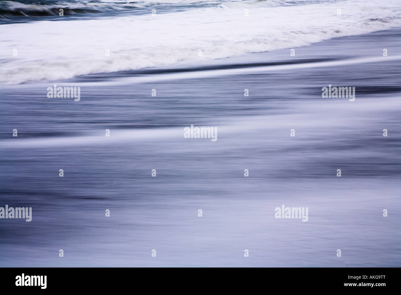 Waves motion on ocean beach Stock Photo - Alamy