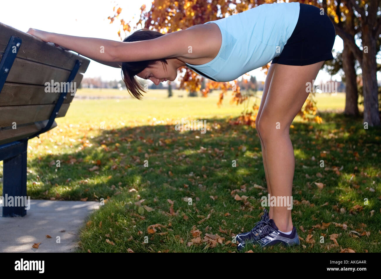 Young woman stretching hamstrings Stock Photo - Alamy