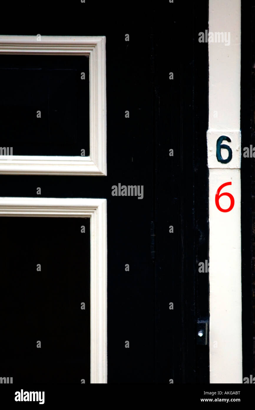 Door of house numbered sixty six Stock Photo - Alamy