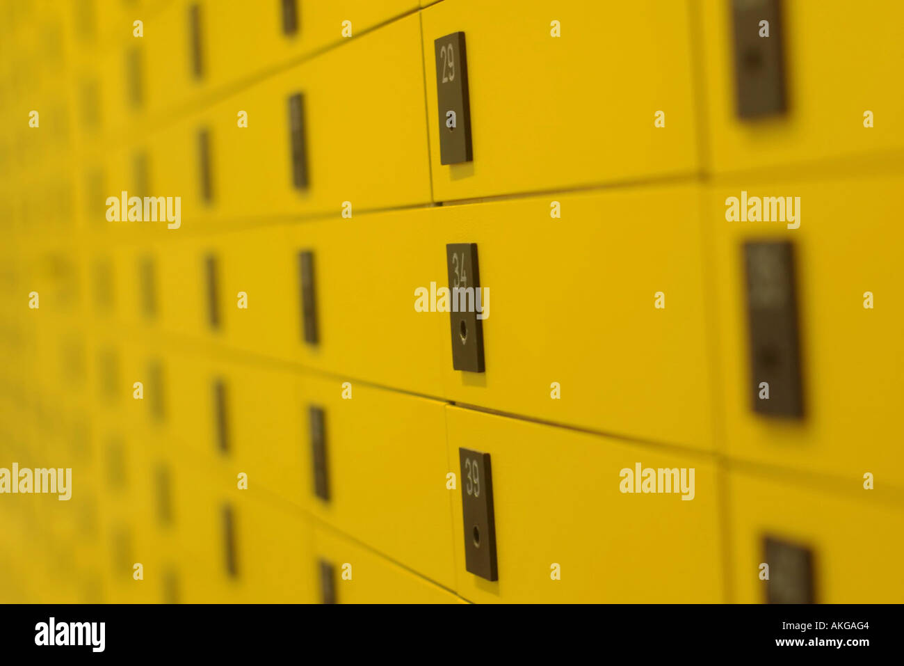 yellow lock boxes very shallow DOF Stock Photo - Alamy