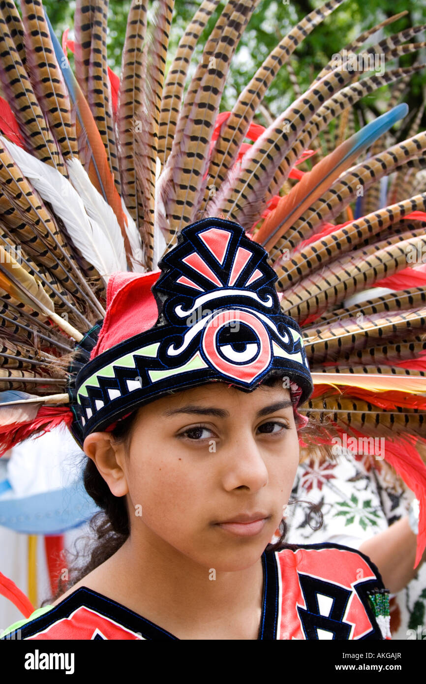 Teen age 16 dressed in Aztec feathered costume for parade. MayDay ...