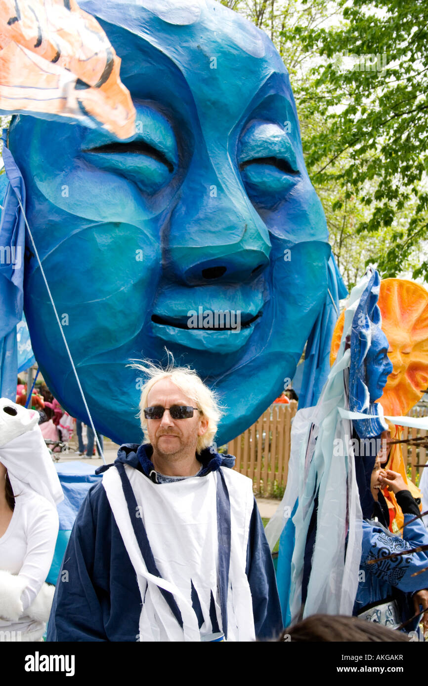 Large blue moon puppet marching in parade to The Tree of Life Ceremony ...