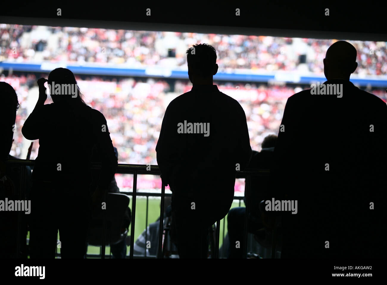 people watching a sports game in a stadion Stock Photo - Alamy