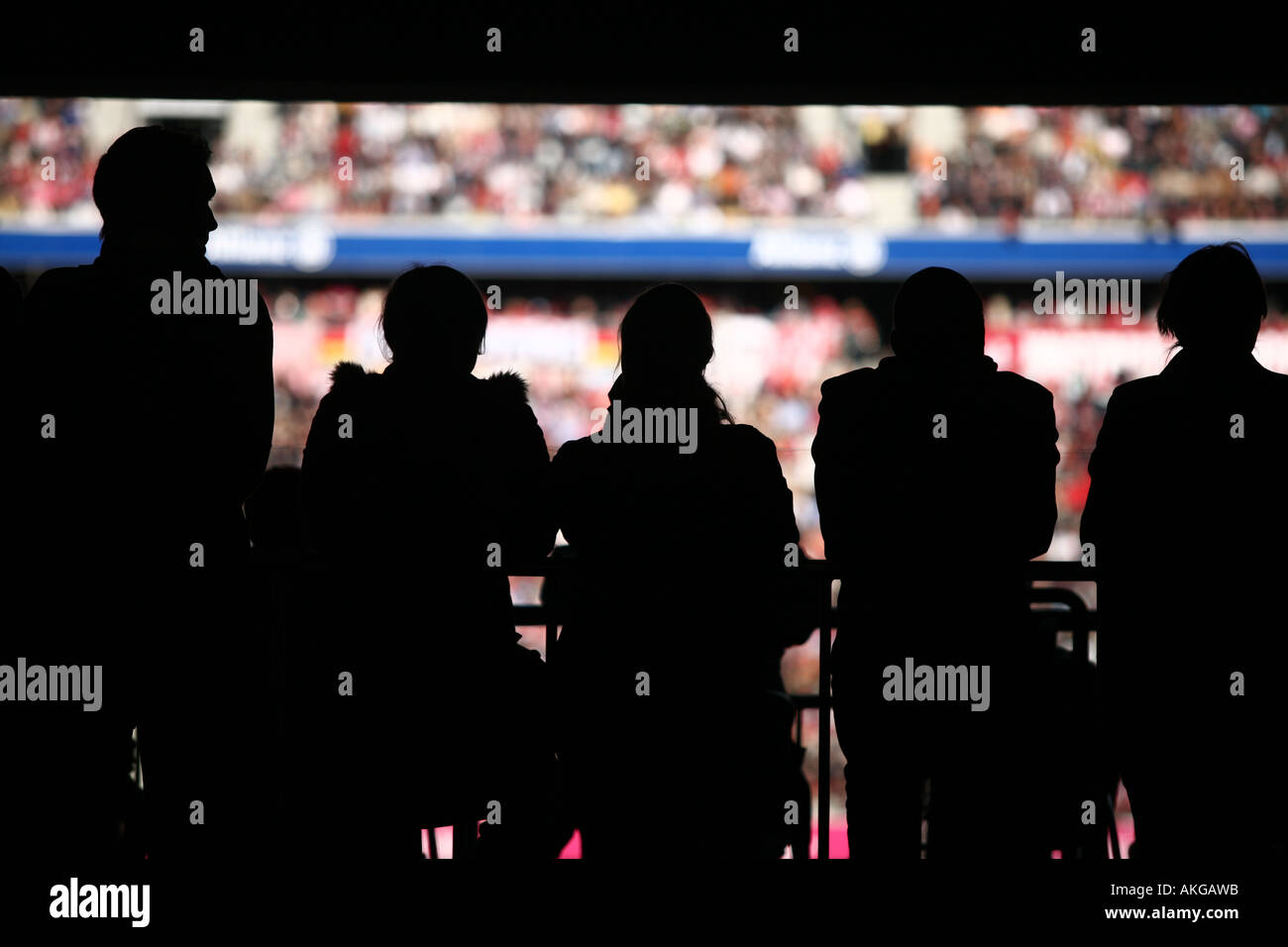 people watching a sports game in a stadion Stock Photo - Alamy