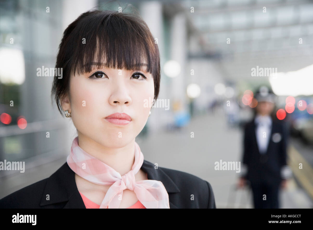 Close-up of a female cabin crew looking up Stock Photo - Alamy