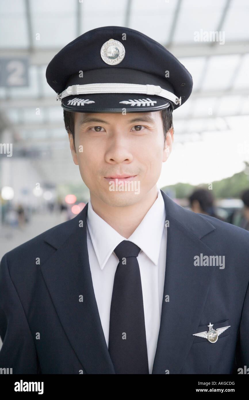 Portrait of a male pilot smiling Stock Photo - Alamy