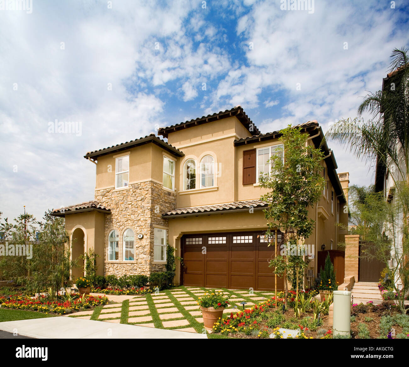 Exterior of a Tuscan Style home in the afternoon Stock Photo - Alamy