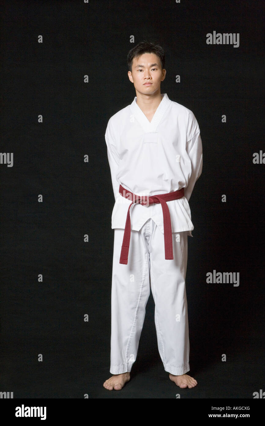 Portrait of a young man standing in gi Stock Photo - Alamy