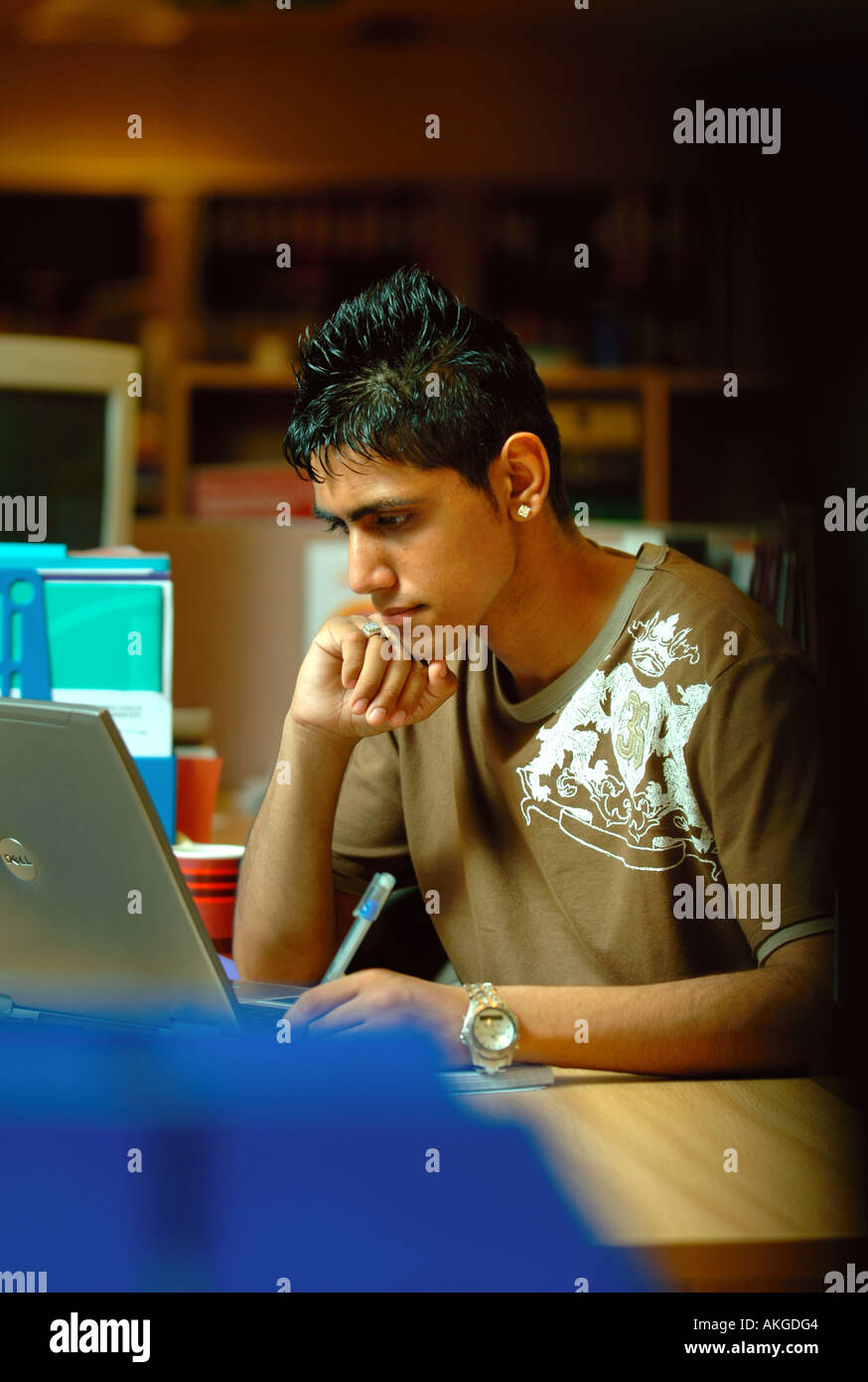 Asian boy writing uk hi-res stock photography and images - Alamy