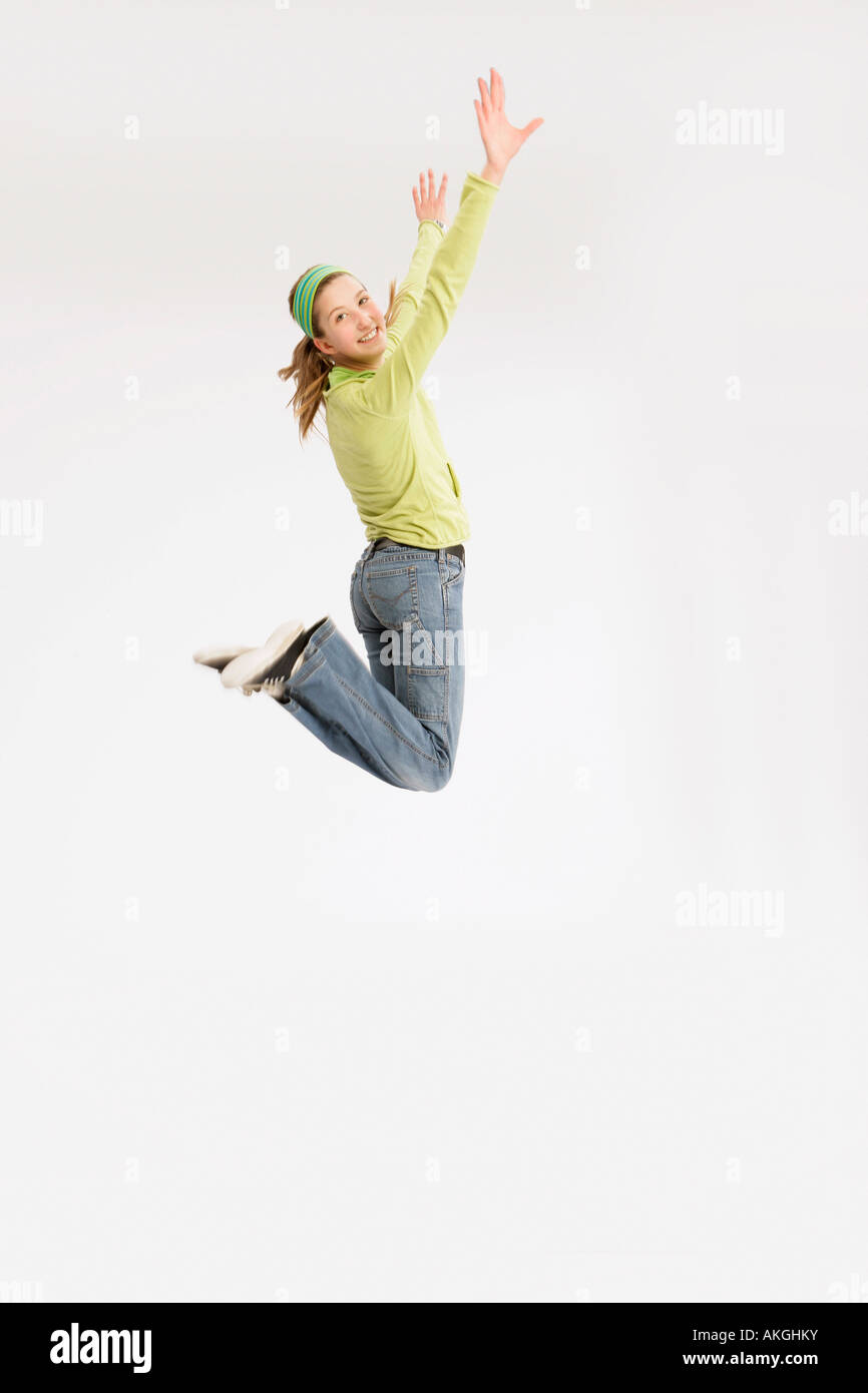 Side view of girl jumping Stock Photo - Alamy