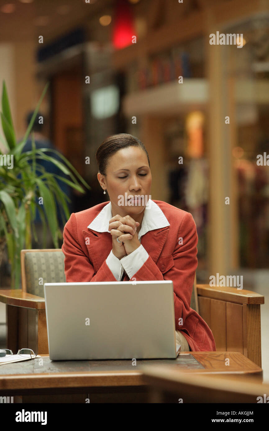 Front view of a woman praying Stock Photo - Alamy