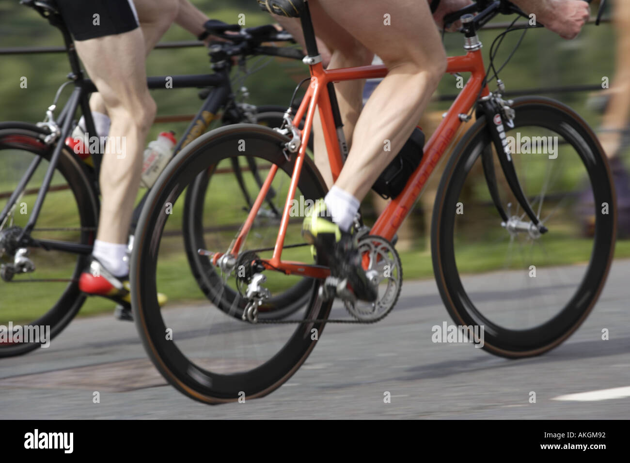 Two cyclesists wheels Stock Photo - Alamy