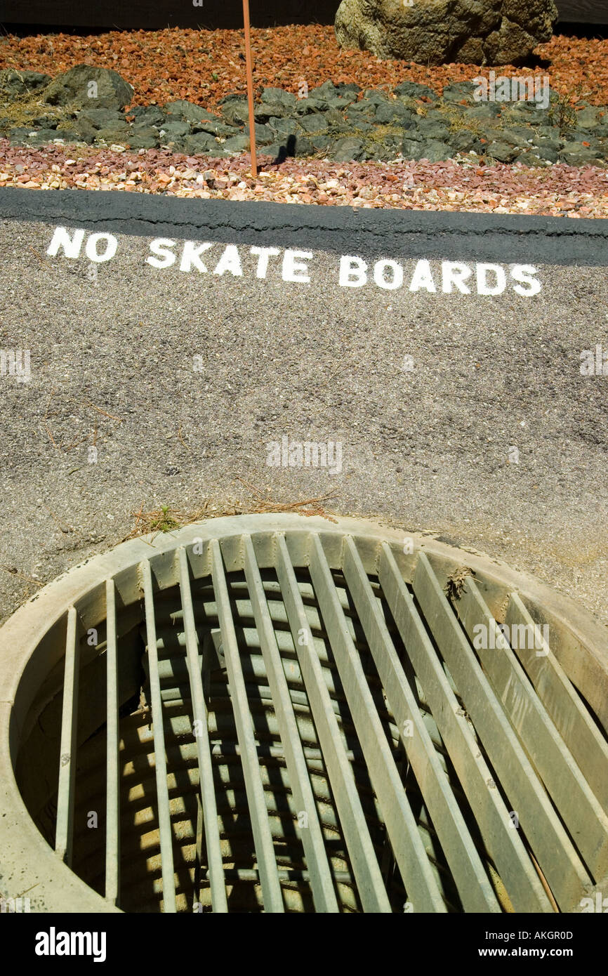 no skating sign with drainage grate Stock Photo - Alamy