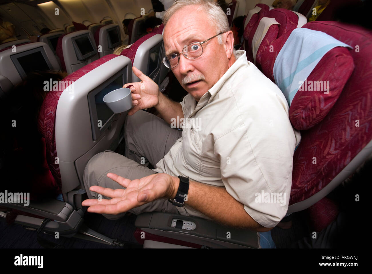 Cramped plane seat hi-res stock photography and images - Alamy