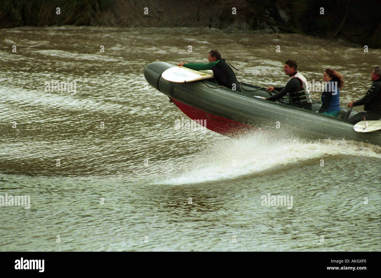 A boat riding the Severn bore wave at Minsterworth, UK Stock Photo - Alamy