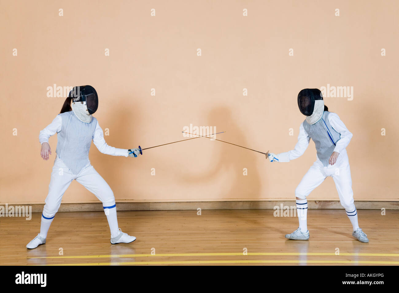 Two fencers fencing Stock Photo - Alamy