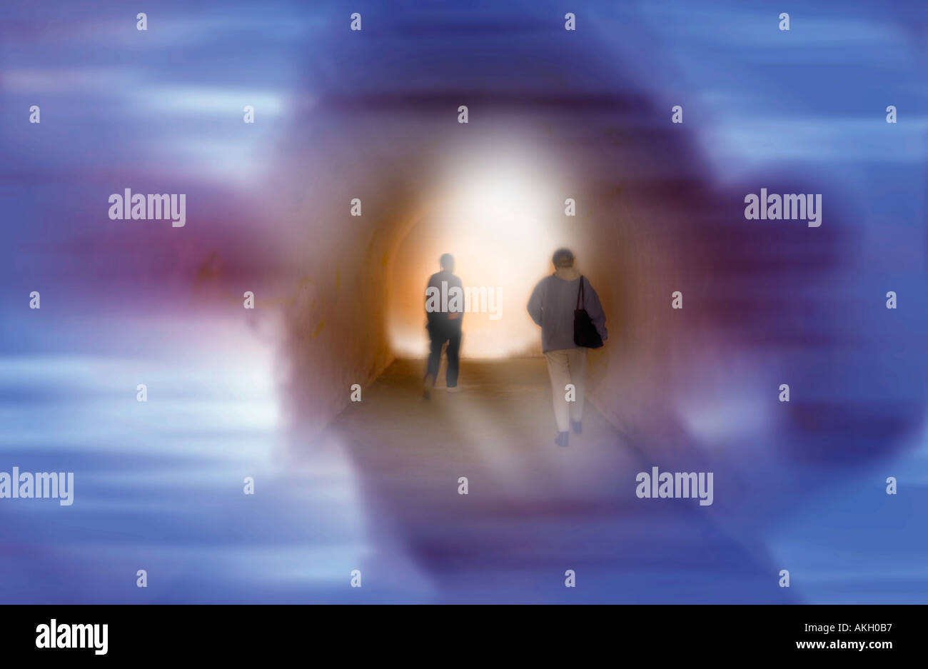 Man and woman walking toward the light Stock Photo - Alamy