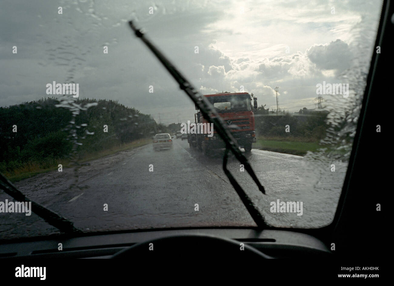 Car driving down windy road hi-res stock photography and images - Alamy