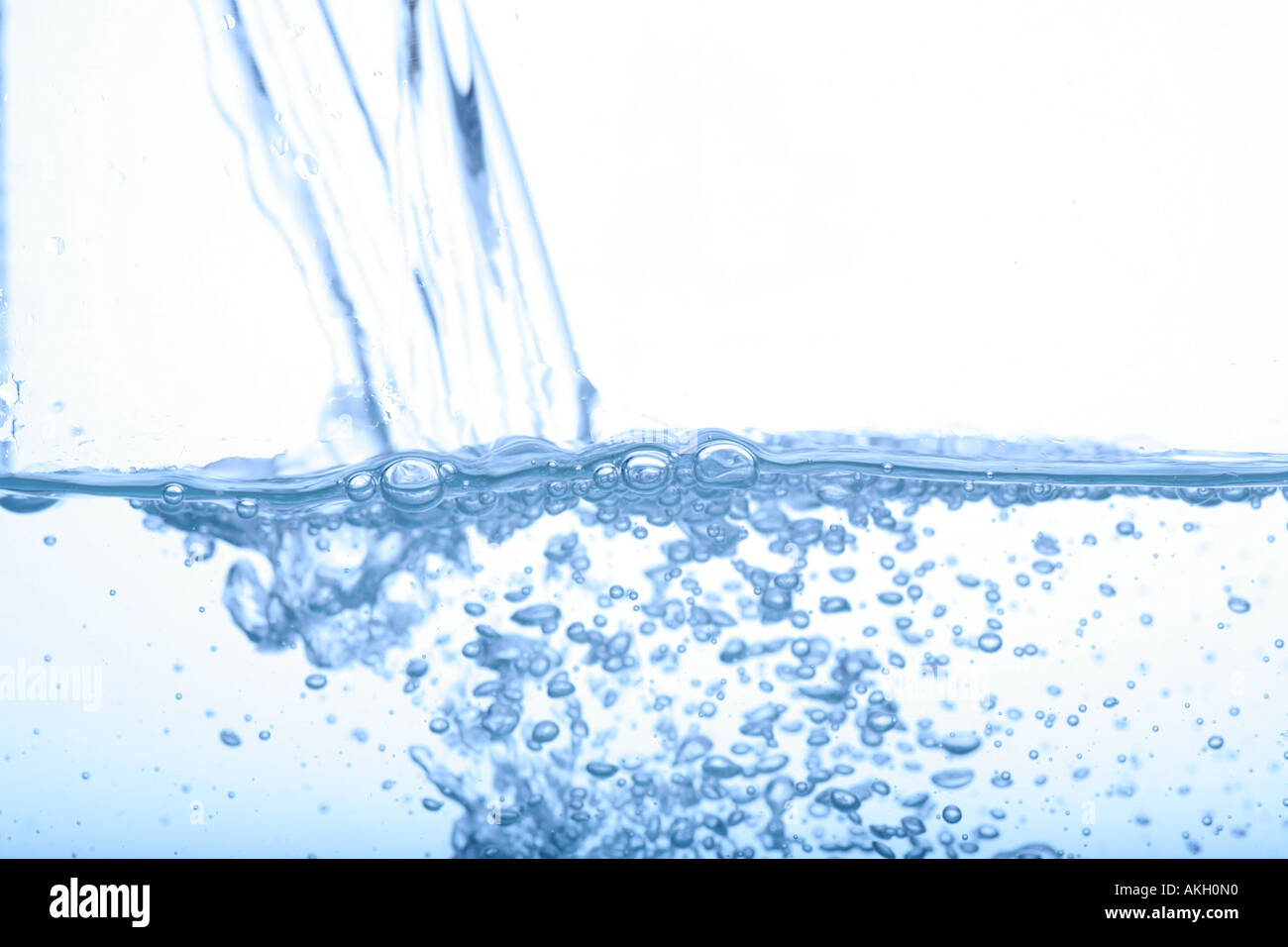 pouring water water splash Stock Photo - Alamy