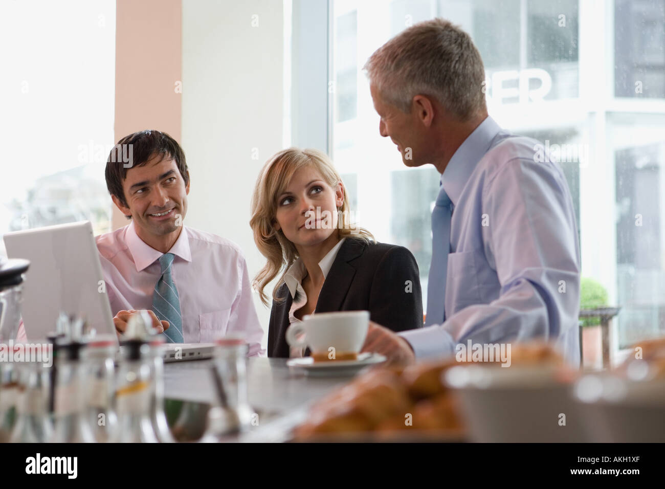 Business people having meeting at bar Stock Photo - Alamy