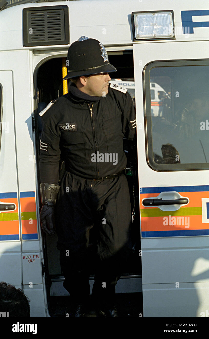 police man coming out of his van dressed in riot gear in Trafalgar ...