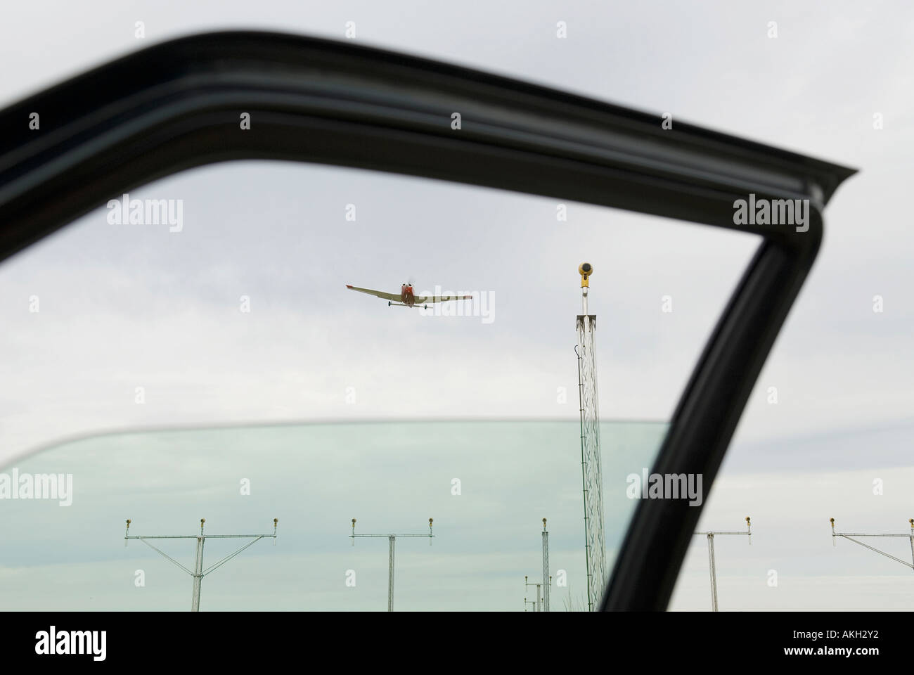 aircraft landing at airport through car window Stock Photo - Alamy